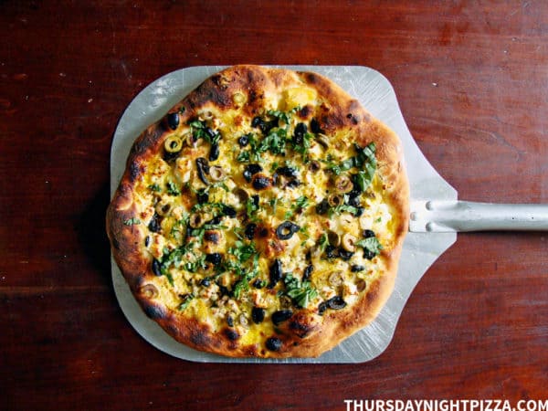 Moroccan-Inspired Pizza with Preserved Lemon, Saffron Cream & Olives